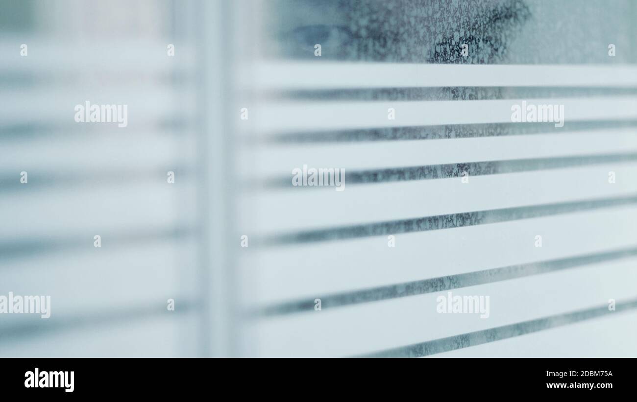 Male Figure Peering Through Window Stock Photo - Alamy