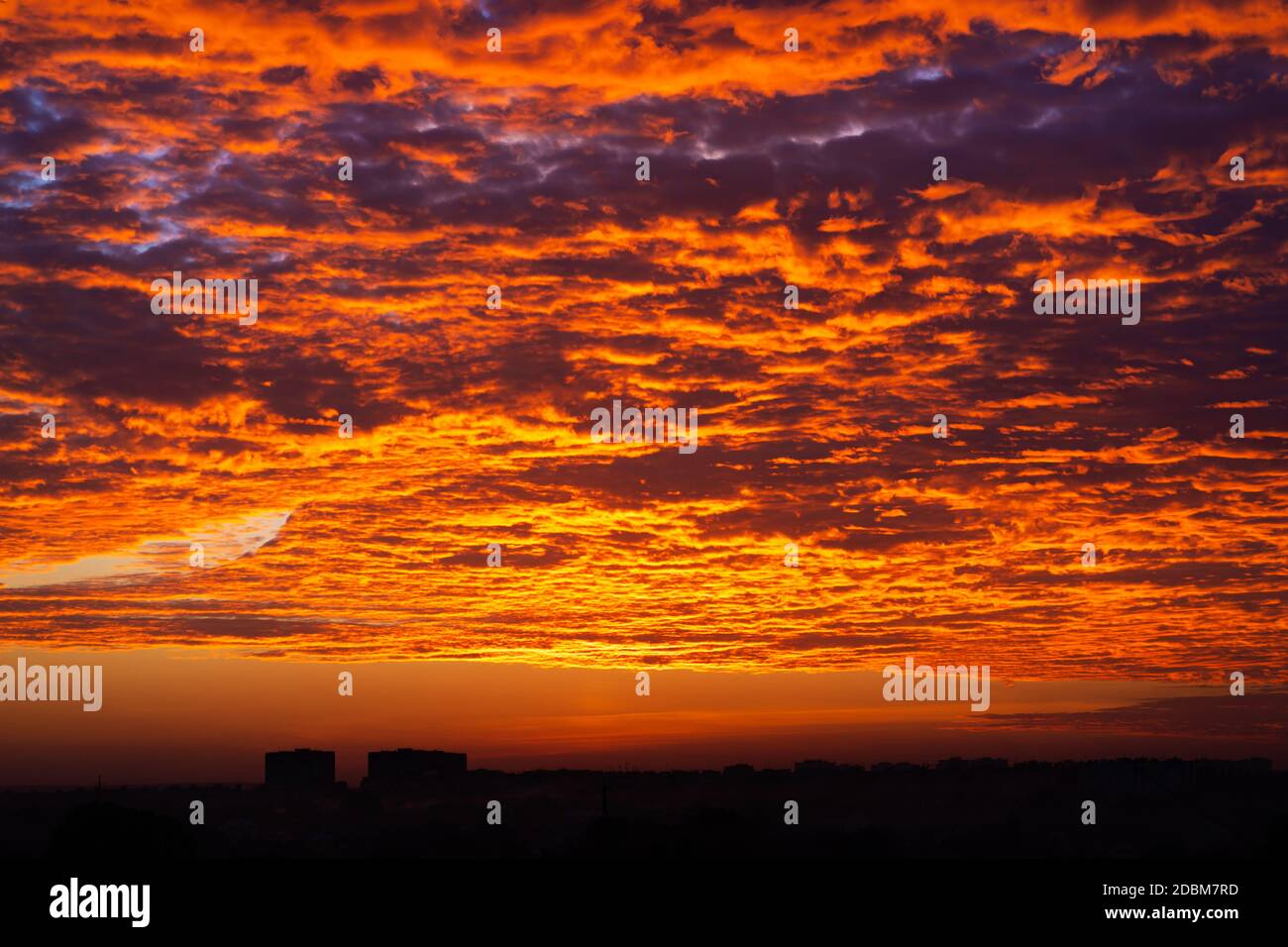 The colors of a burning sunset in the sky Stock Photo - Alamy