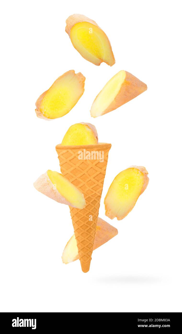 Isolated ice cream cone with fruits in the air. Falling cut ginger ...