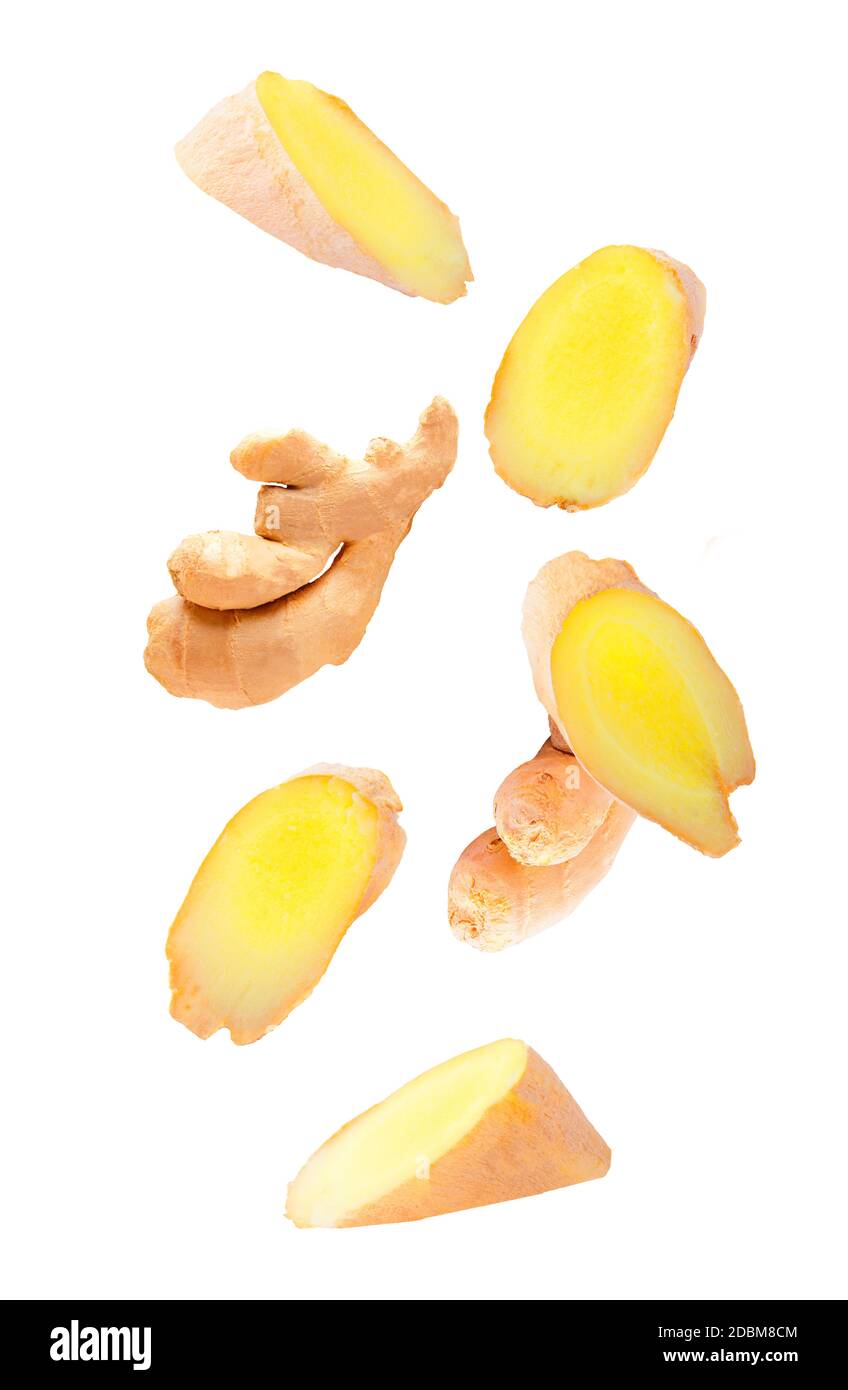 Isolated flying fruit. Seven pieces of falling ginger root on white ...