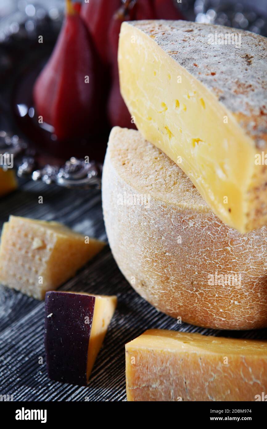 Cheese heads cut in half on wooden background. Macro photo interior ...