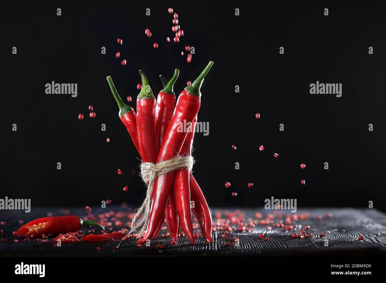 Hot red pepper pods on a black background. Copy space Stock Photo - Alamy