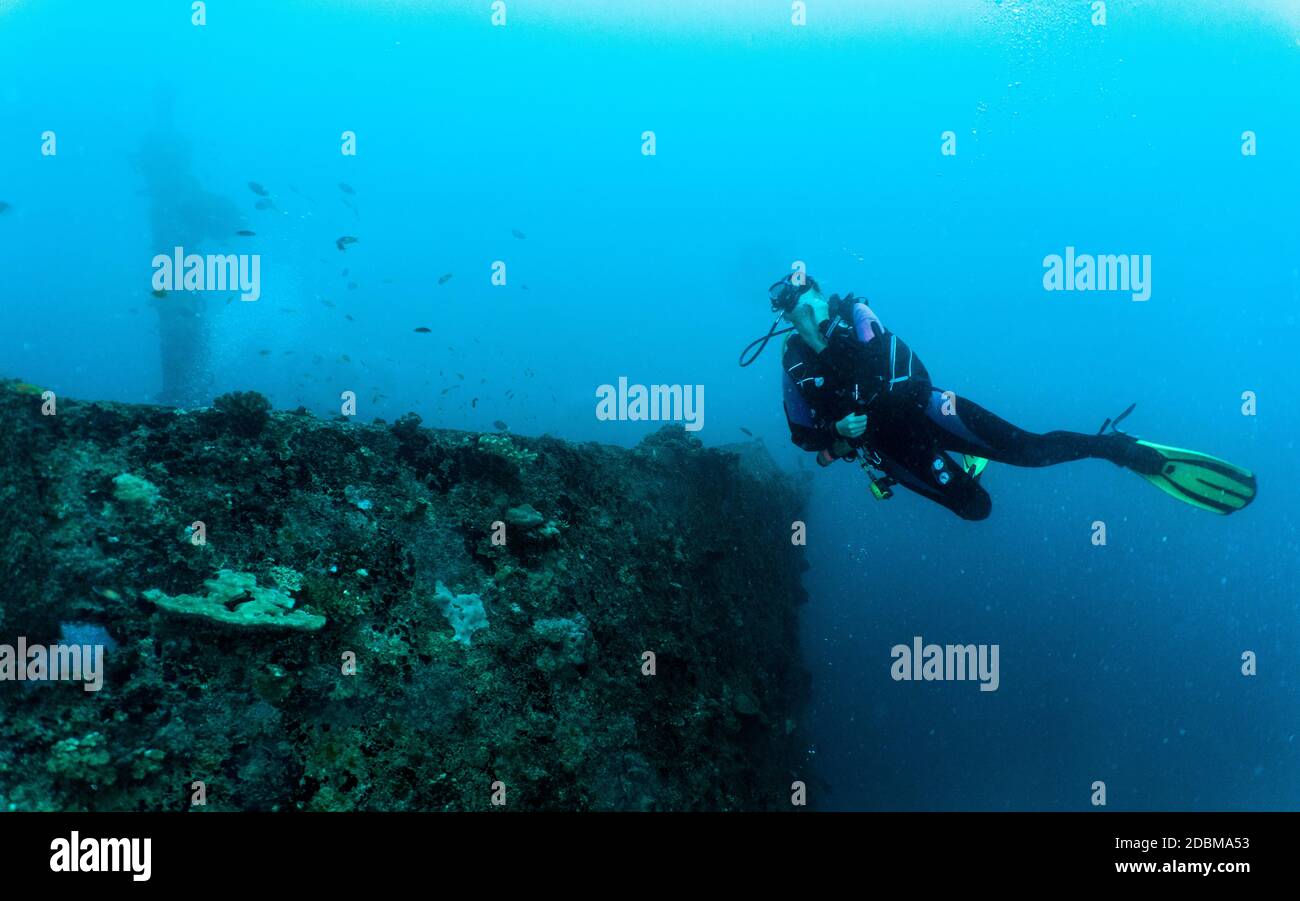 Scuba diver approaching shipwreck in Ari Atoll, Maldives Stock Photo ...