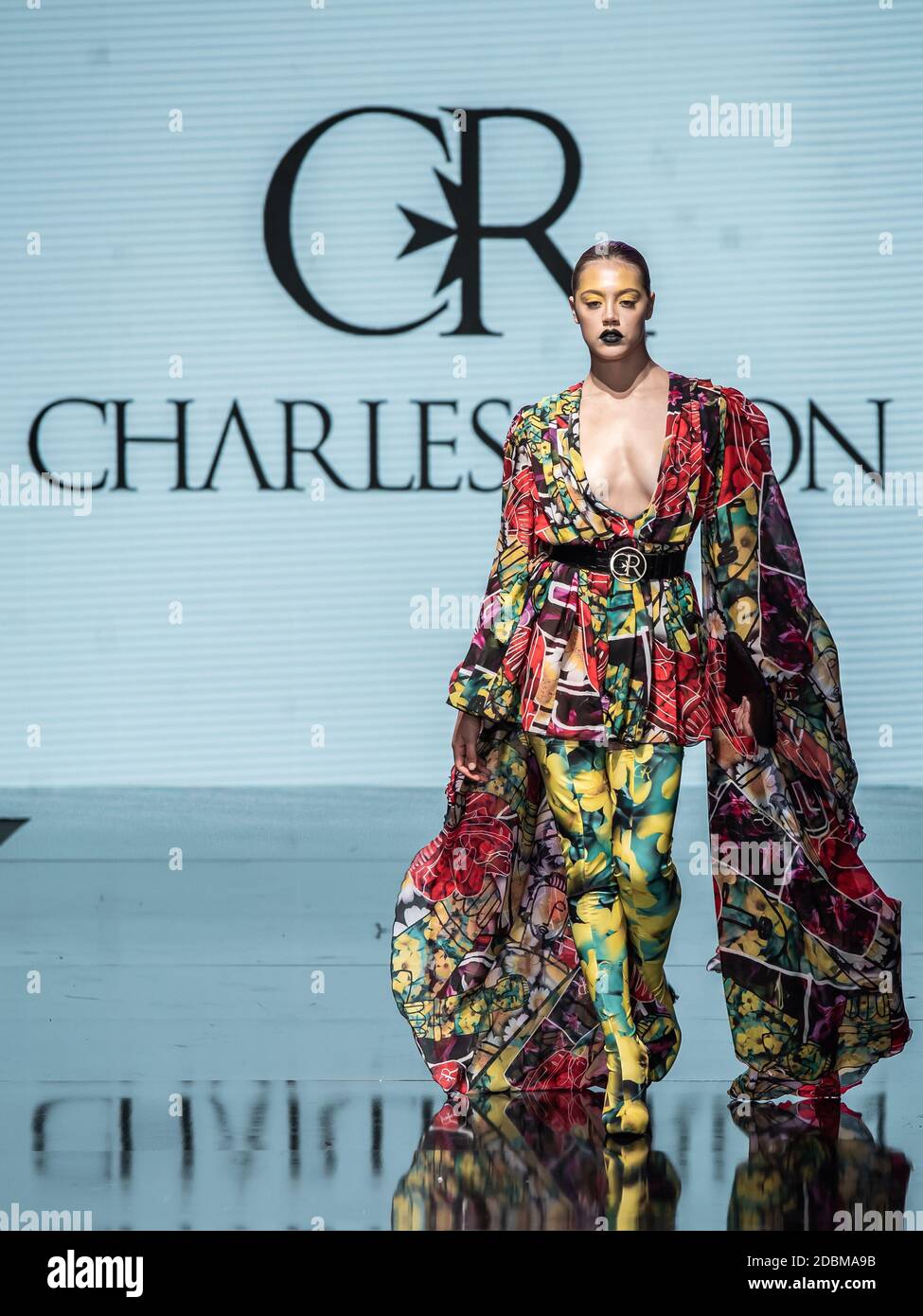 A model walks the runway for Charles and Ron at Los Angeles Fashion ...