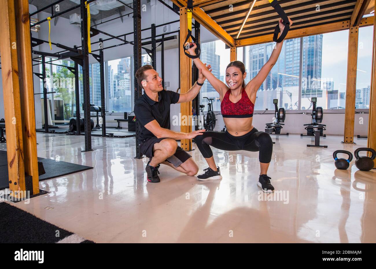 Trainer assisting client hi-res stock photography and images - Alamy