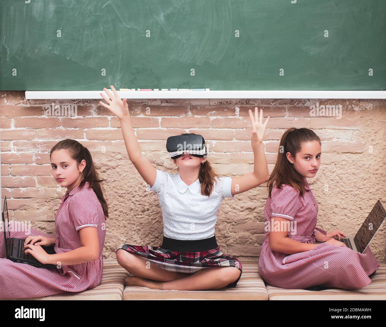 Girls vintage dresses study with modern gadgets. Modern education ...