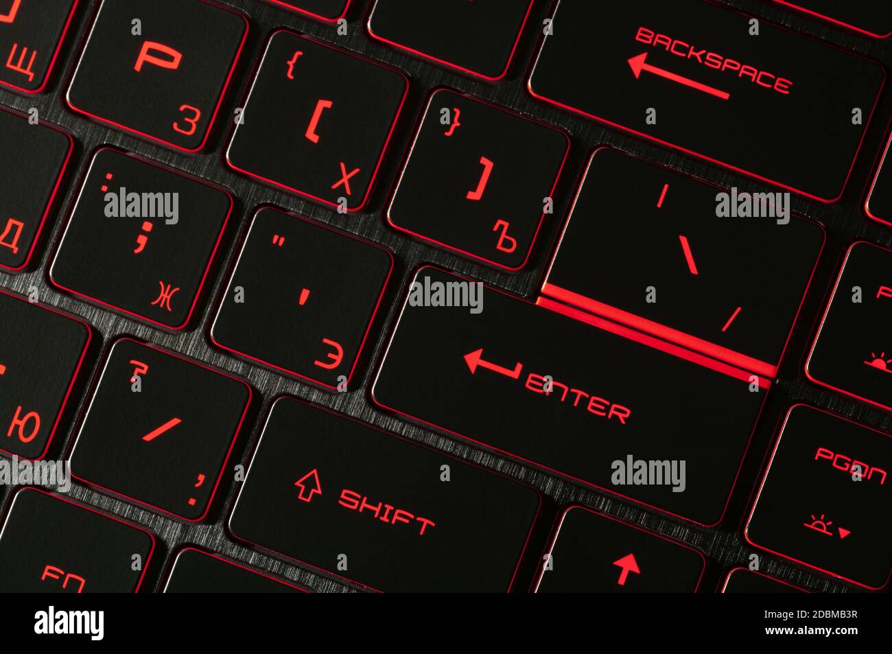 Enter key. Red backlight, backlit on gaming laptops computer in the ...