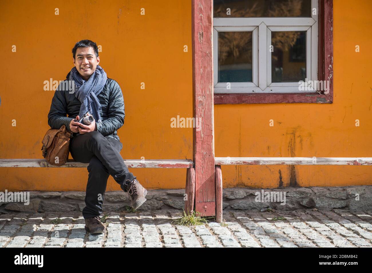Man sitting on bench, Ulaanbaatar, Mongolia Stock Photo - Alamy