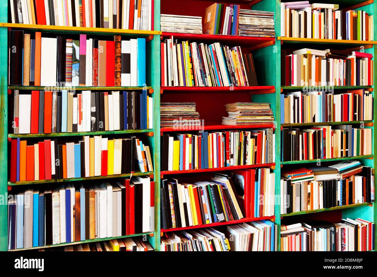 Angle shot of book rack with big collection Stock Photo - Alamy