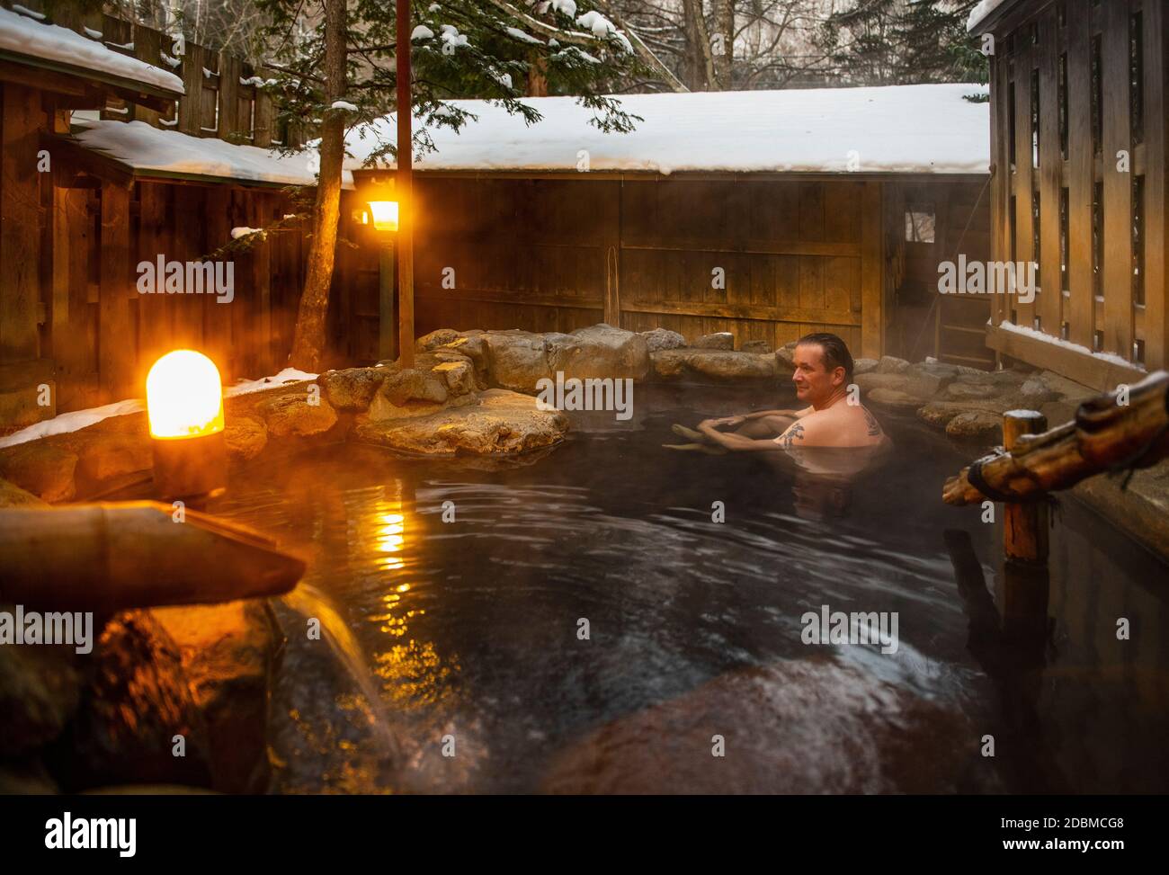 caucasian man enjoying a bath in a traditional Japanese Onsen spa Stock ...