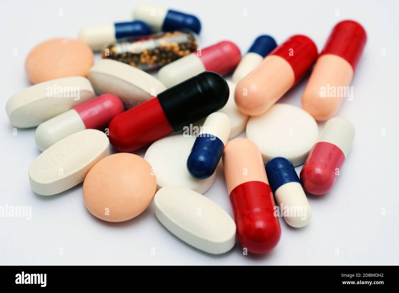 Pills close up over white Stock Photo - Alamy