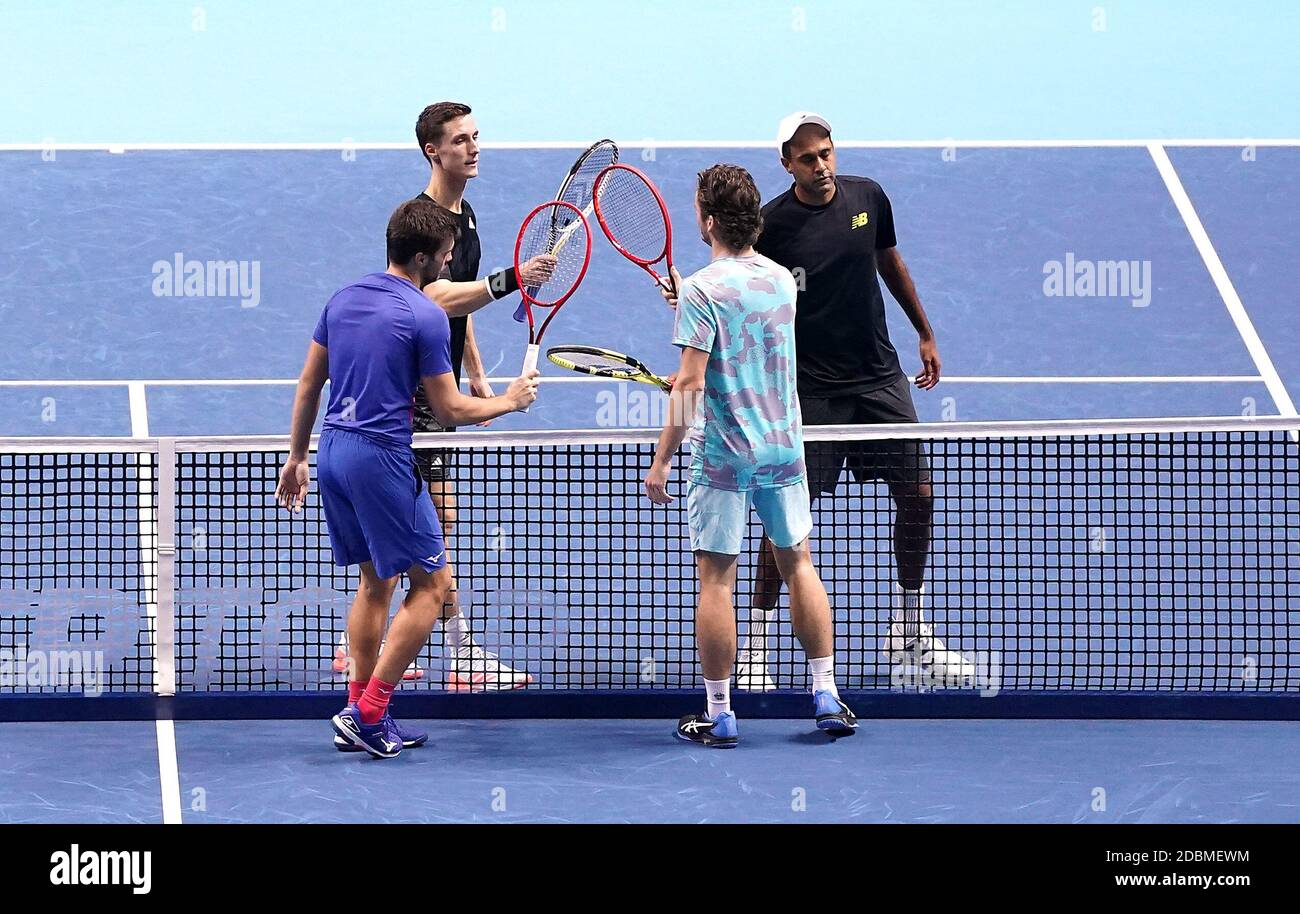 Rajeev Ram and Joe Salisbury (top of court) touch racquets with Wesley ...
