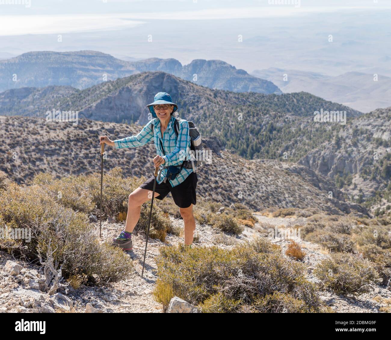 Front view of a female hiker on her way to the top of Notch Peak. Notch ...