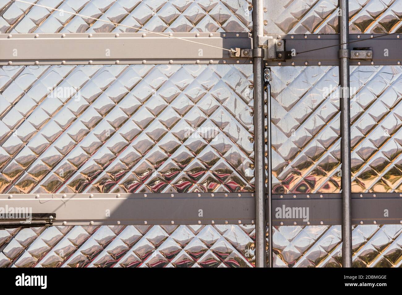 Close up, detail of the tractor trailer metal siding finish on the rear ...