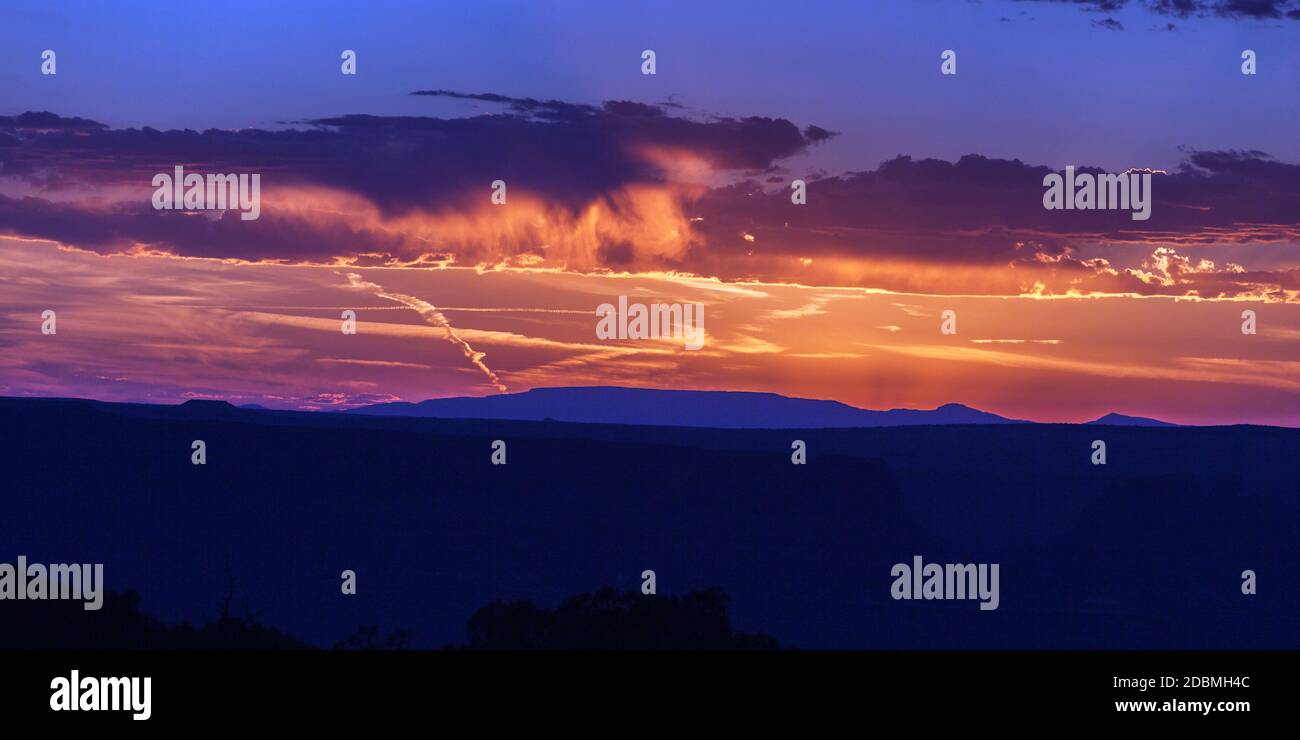 Panoramic sunset with clouds Stock Photo - Alamy