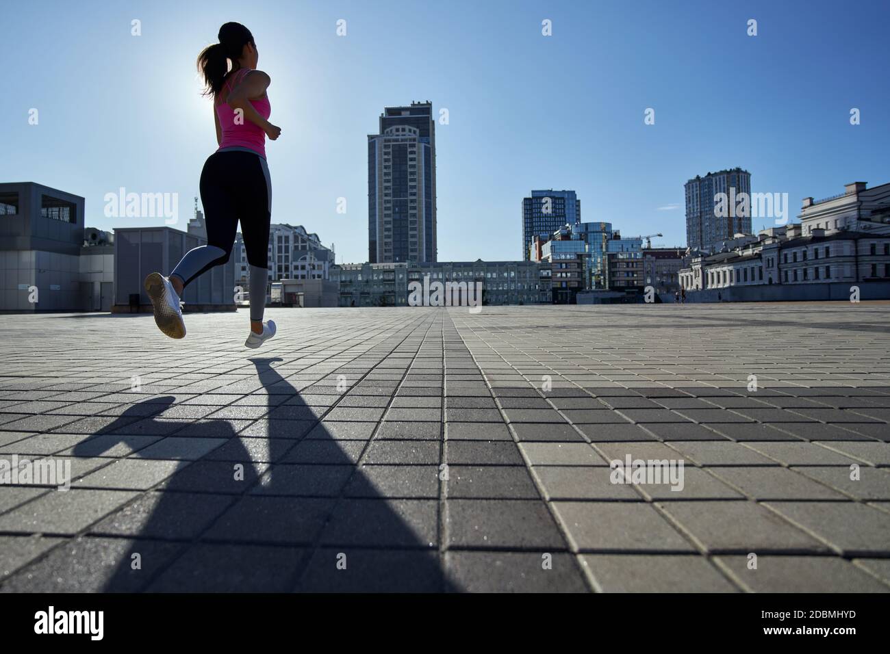 Woman jog street rear view hi-res stock photography and images - Alamy