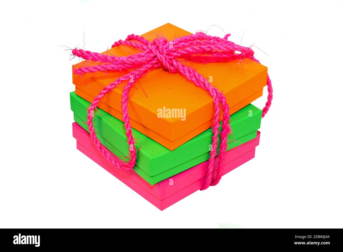Three vivid color boxes with rope isolated Stock Photo - Alamy