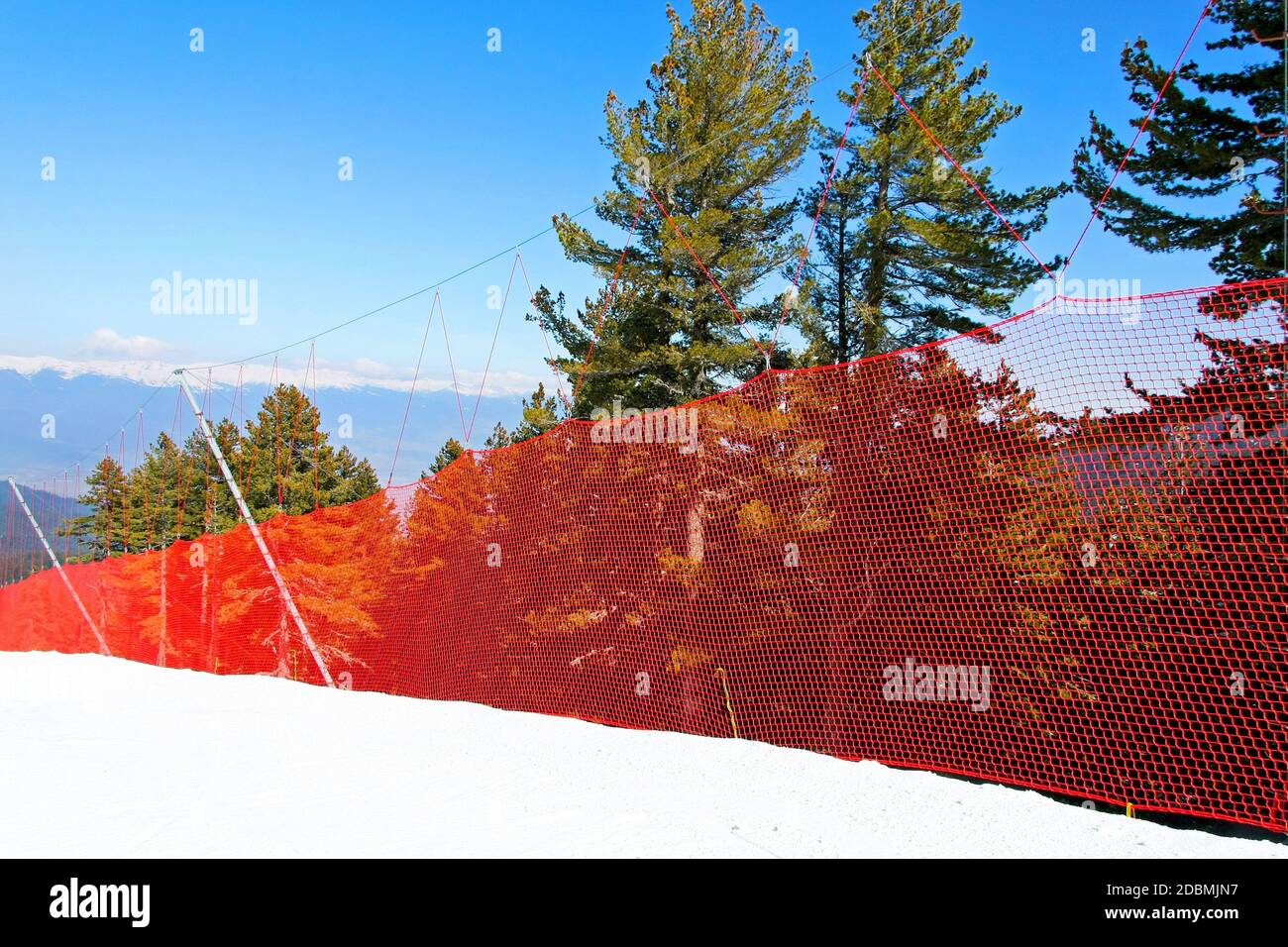 Safety net on the side of ski slope Stock Photo - Alamy