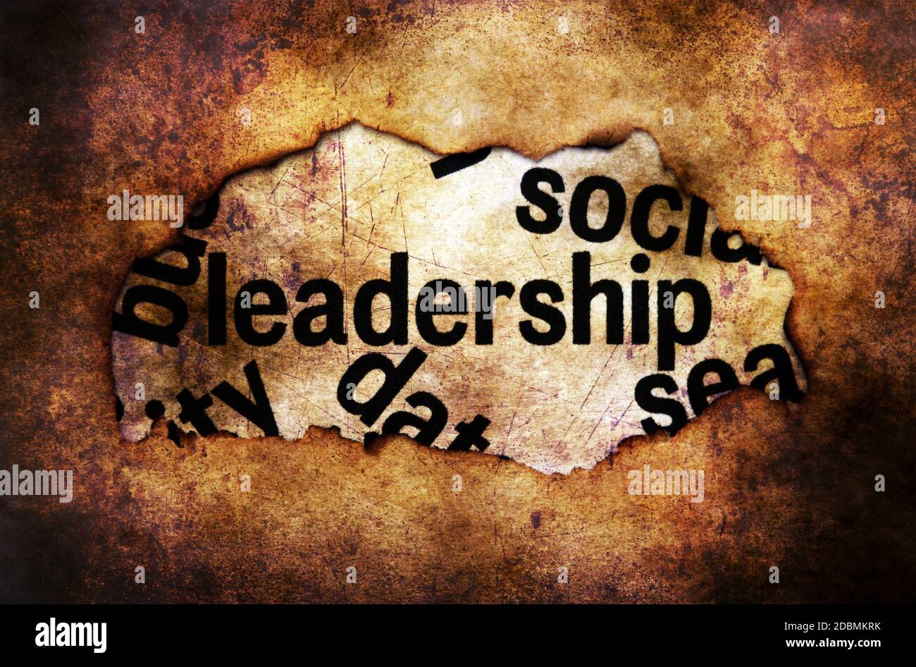 Leadership text on paper hole grunge concept Stock Photo - Alamy