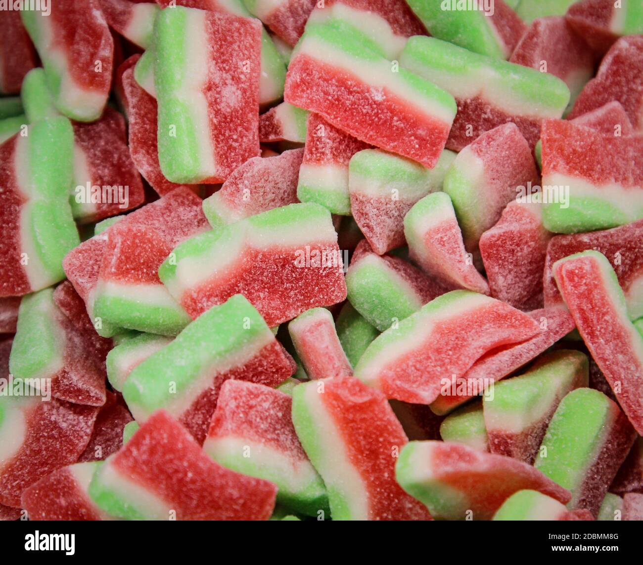 Small, sweet treats in a row for young and old Stock Photo - Alamy