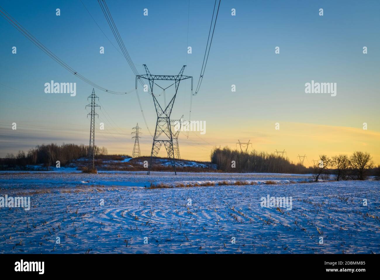 High voltage electricity transmission towers by aerial cables in winter ...