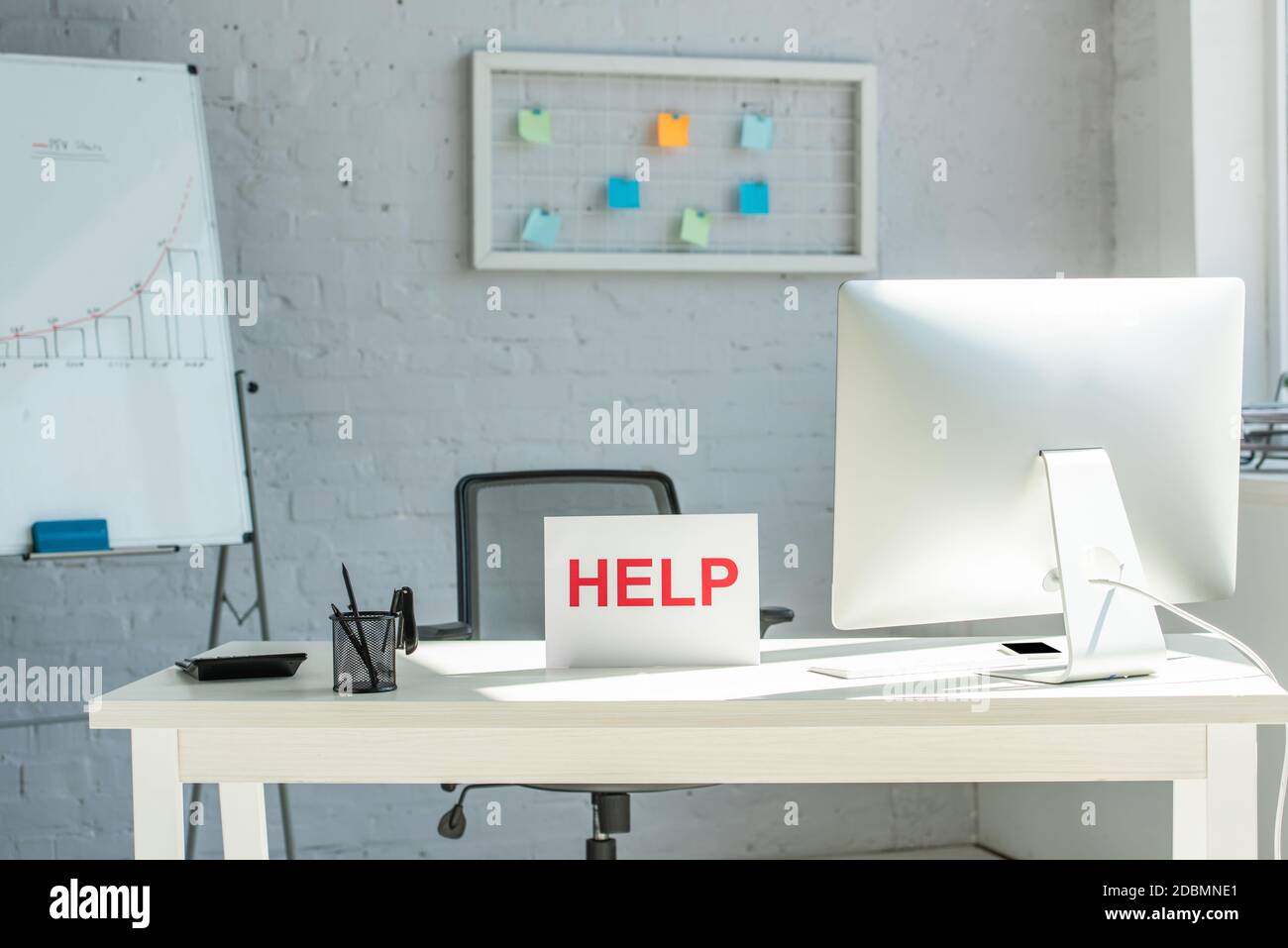 Interior of modern workplace and sign with help lettering Stock Photo ...