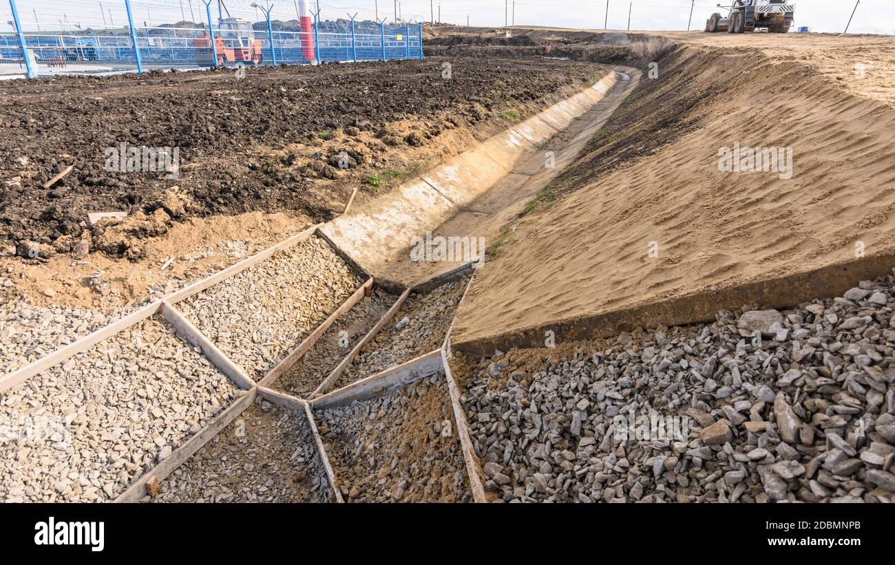Strengthening the slope and constructing a drainage ditch along the ...