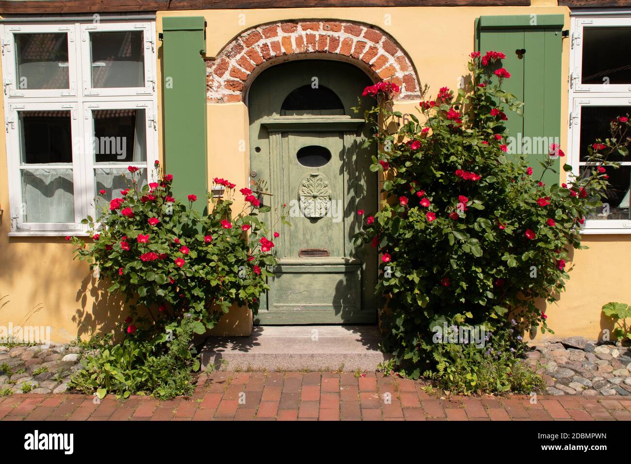 A old house with roses Stock Photo - Alamy