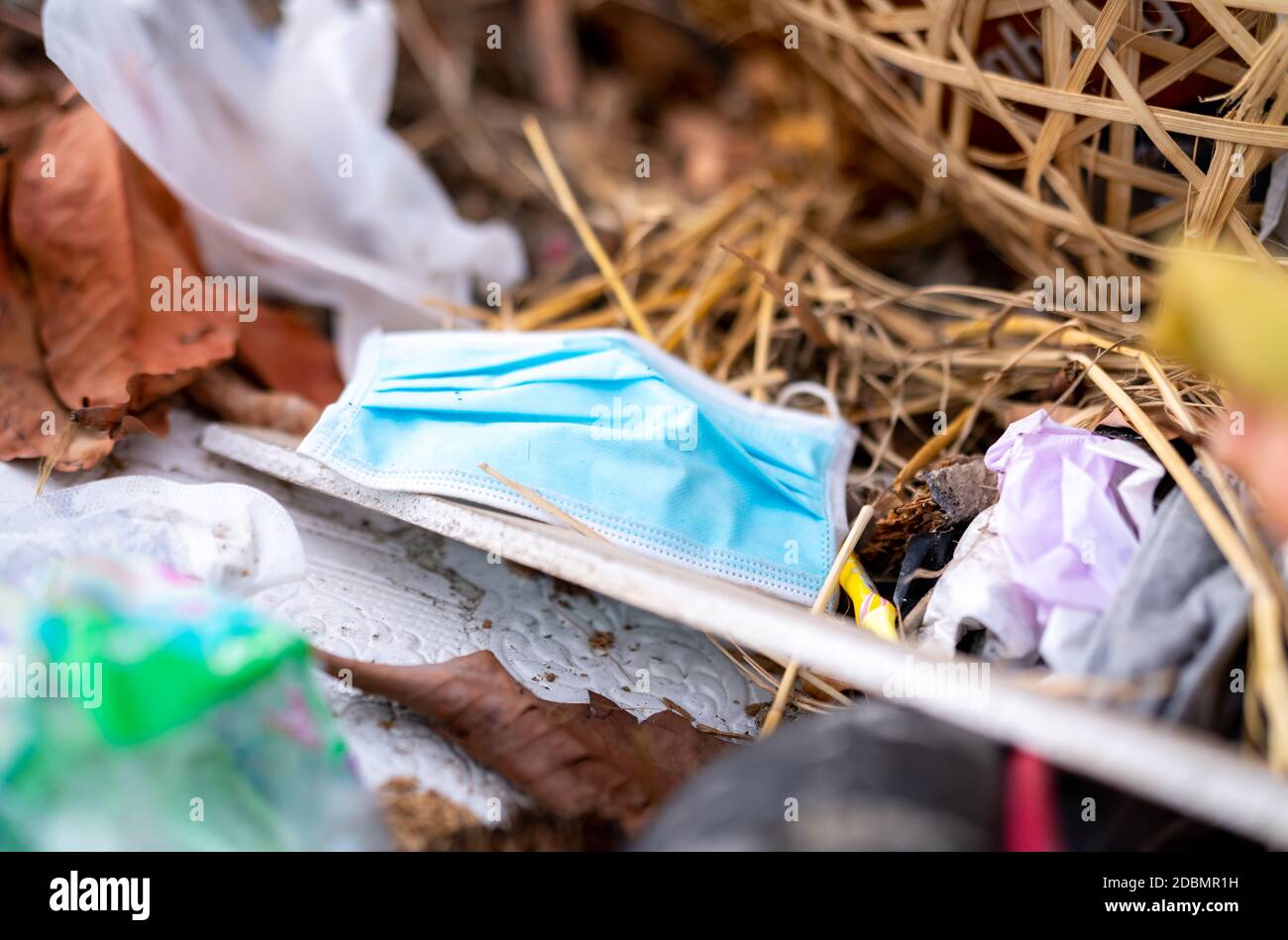 Used face mask discard in household garbage. Medical waste disposal ...