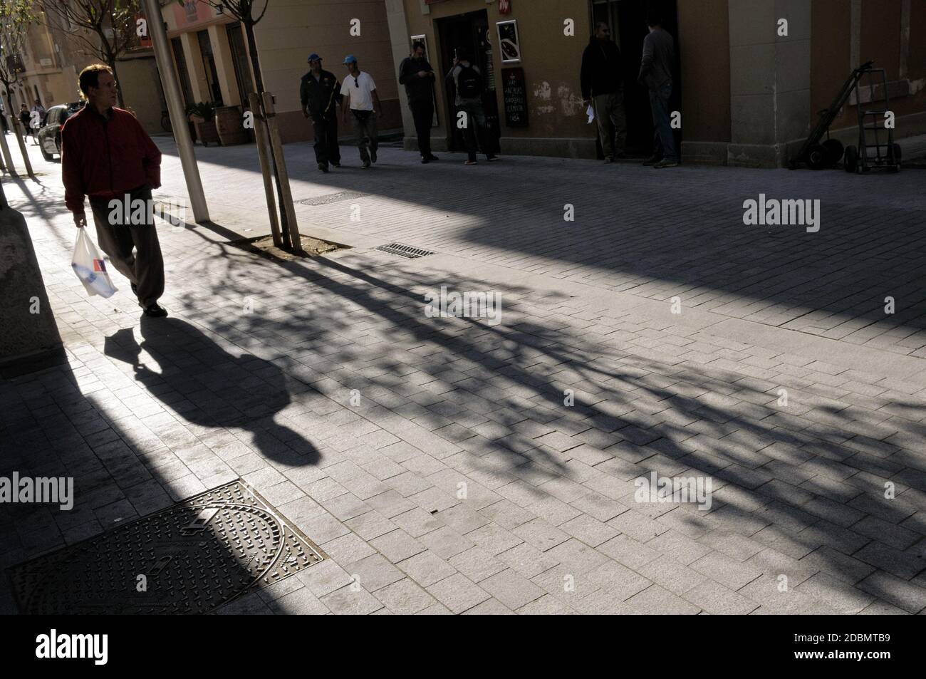 Man and his shadow in the Barceloneta neighborhood, Barcelona ...