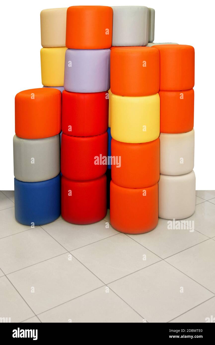 Bunch of cylindrical and colorful stools seats Stock Photo - Alamy