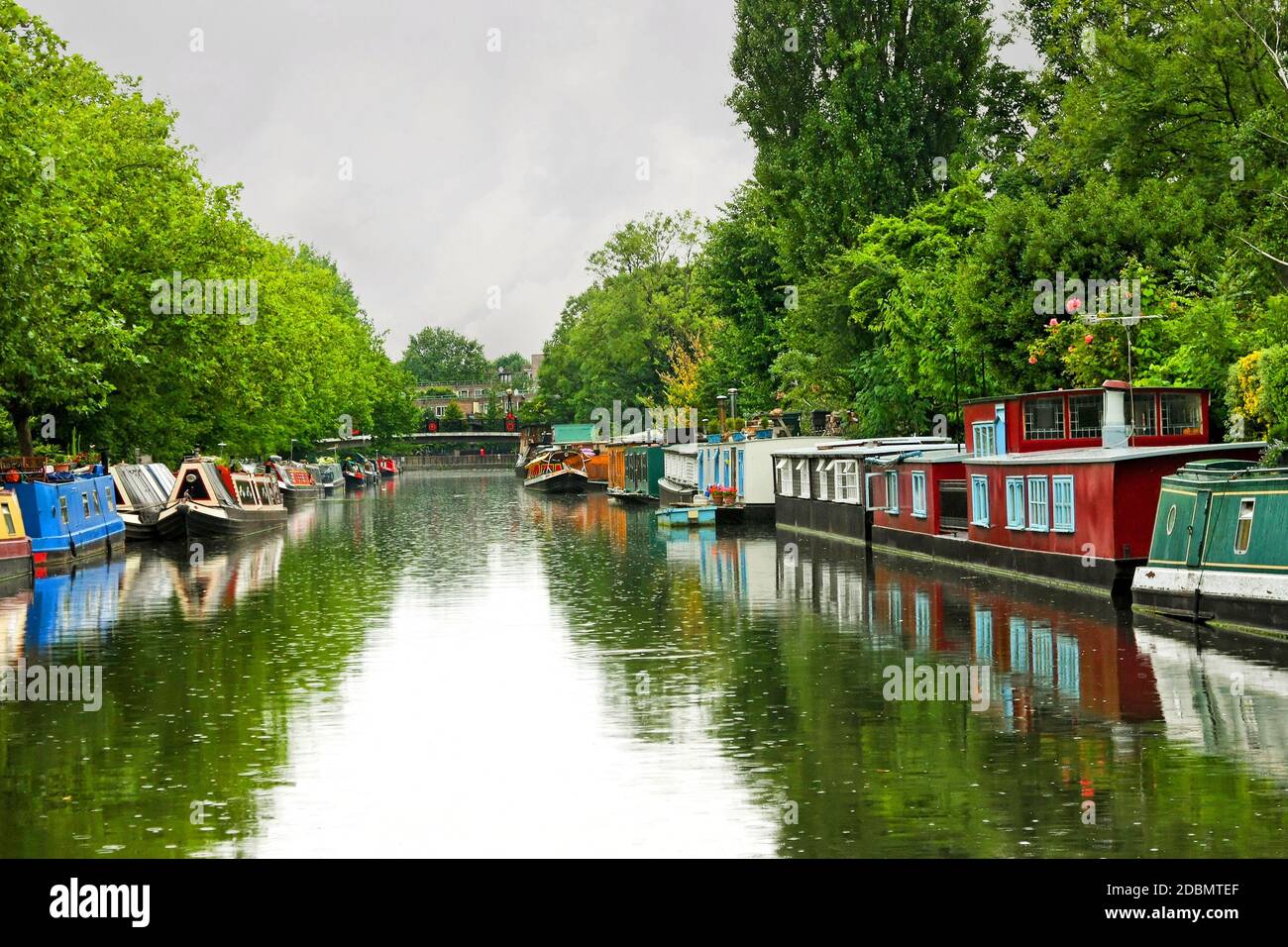 Big channel way with long narrow boats Stock Photo - Alamy