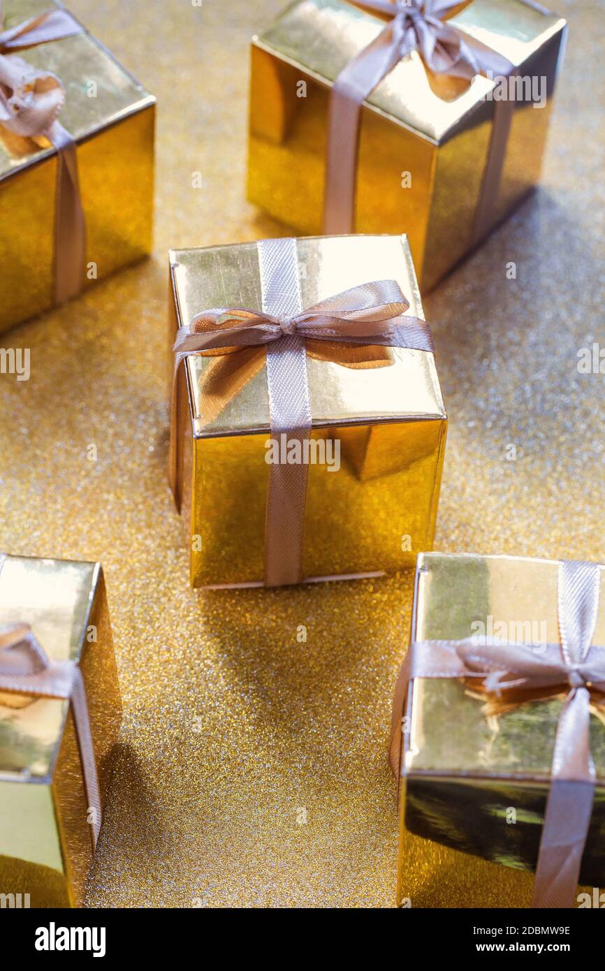 Group of gold sparkling gift boxes, beautiful gold packaging surprise ...