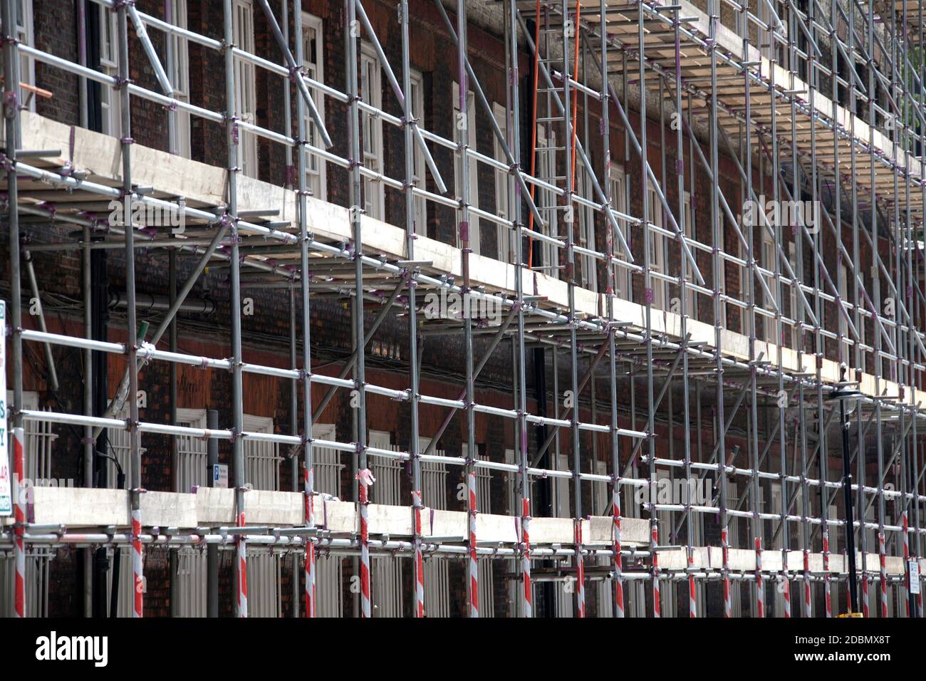 Scaffolding on a building undergoing construction work Stock Photo - Alamy