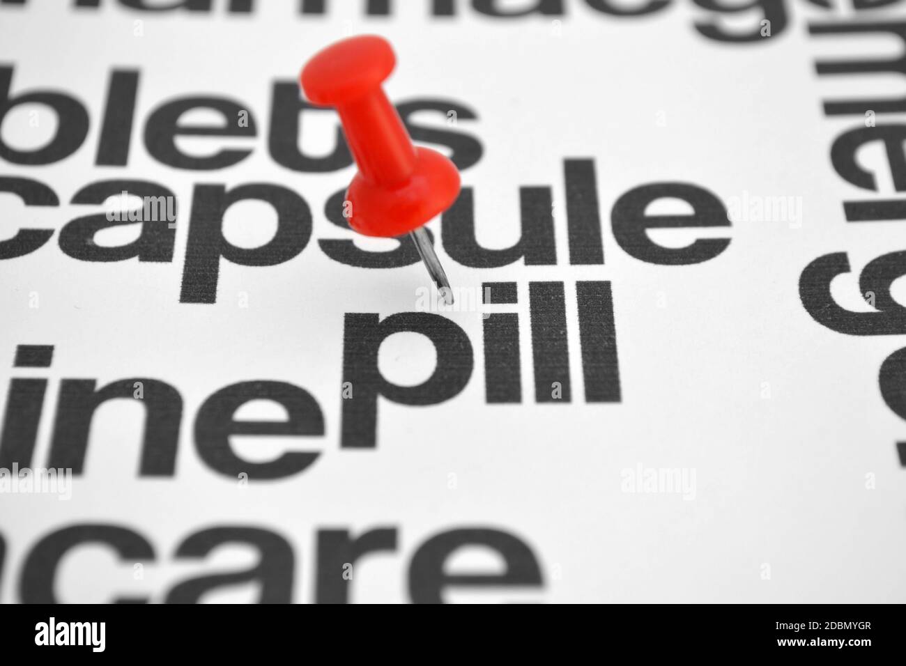 Push pin on pill concept Stock Photo - Alamy