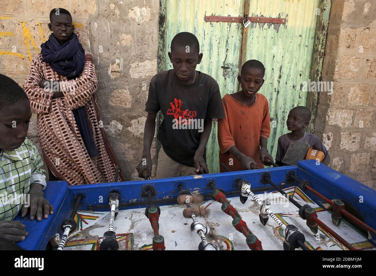 Timbuktu street life ,kids paying table soccer .in Timbuktu , Mali ...