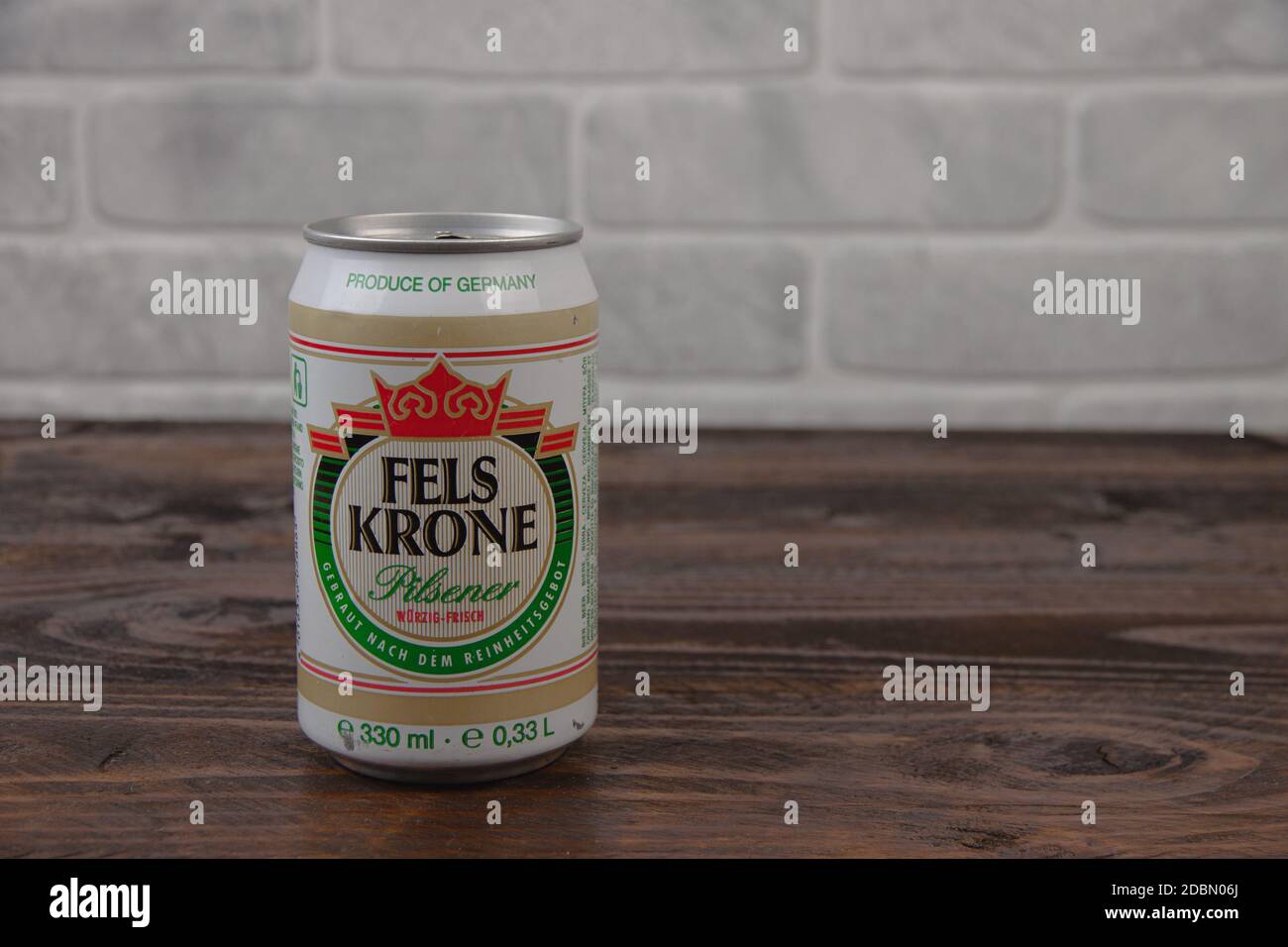 An old aluminium can of Fels Krone Germany beer against the brick wall ...