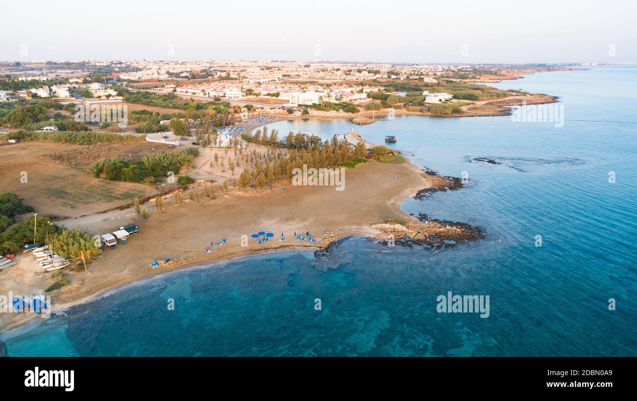 Aerial view of coastline sunset and landmark white washed chapel at ...