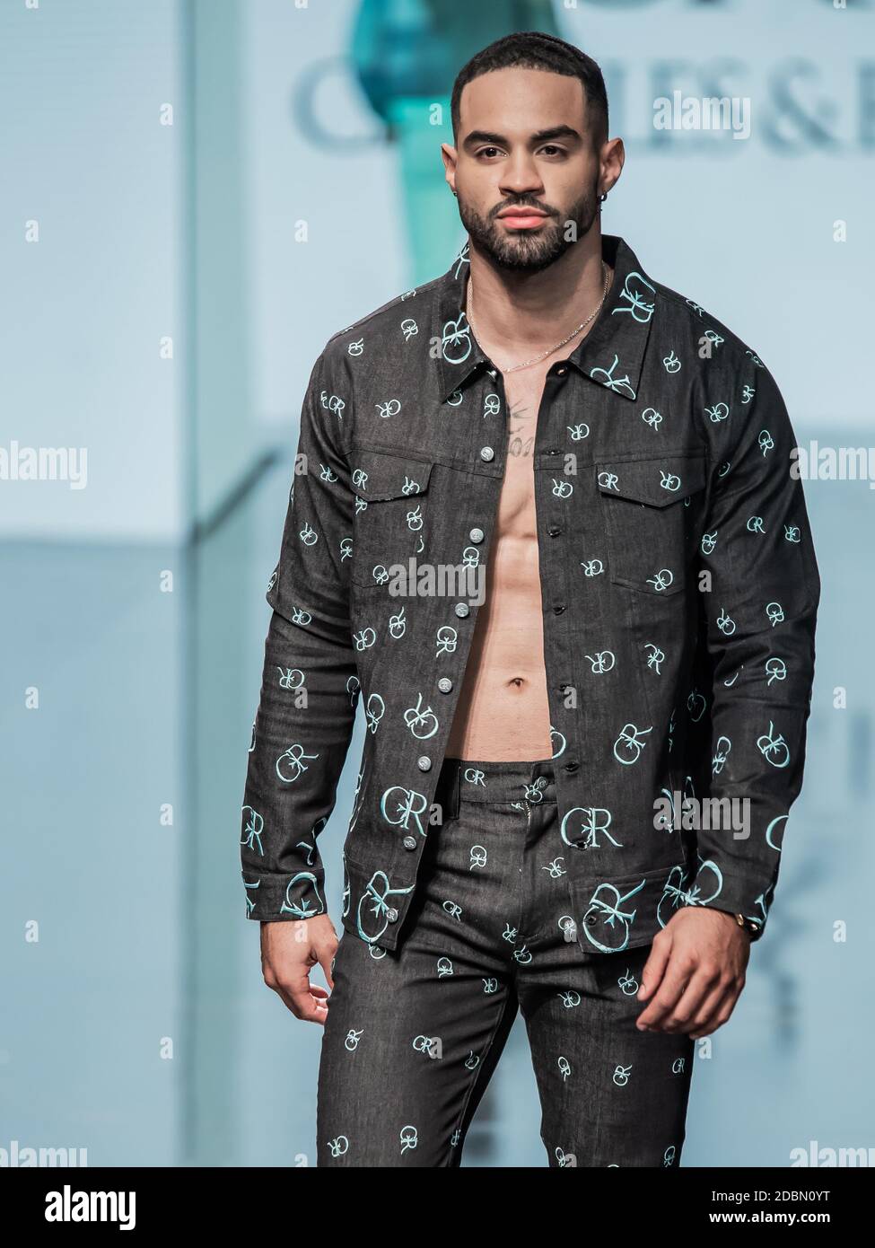 A model walks the runway for Charles and Ron at Los Angeles Fashion ...