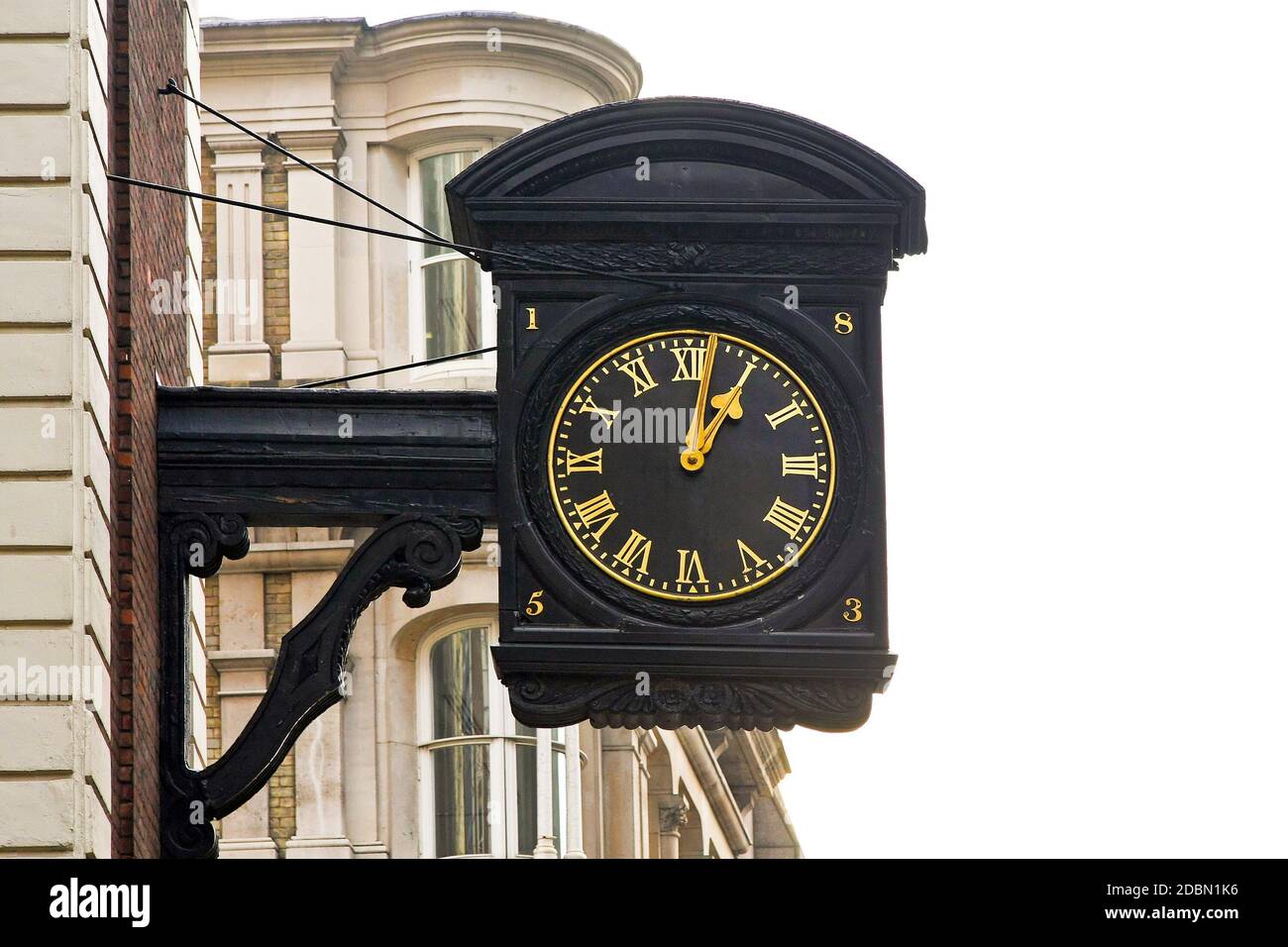 Big public wall clock with golden details Stock Photo - Alamy