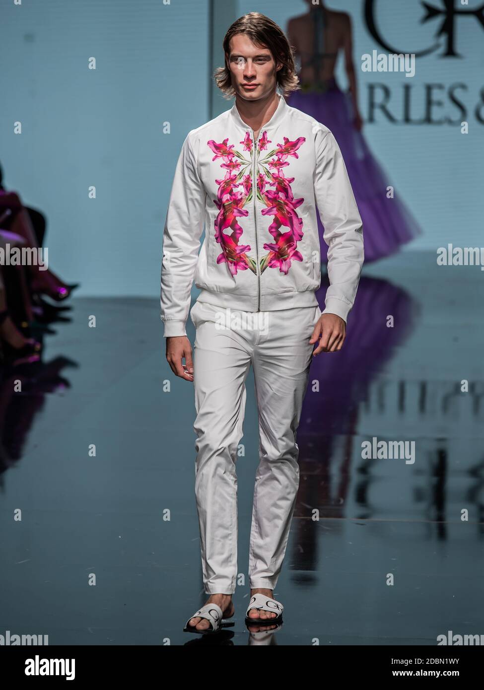 A model walks the runway for Charles and Ron at Los Angeles Fashion ...