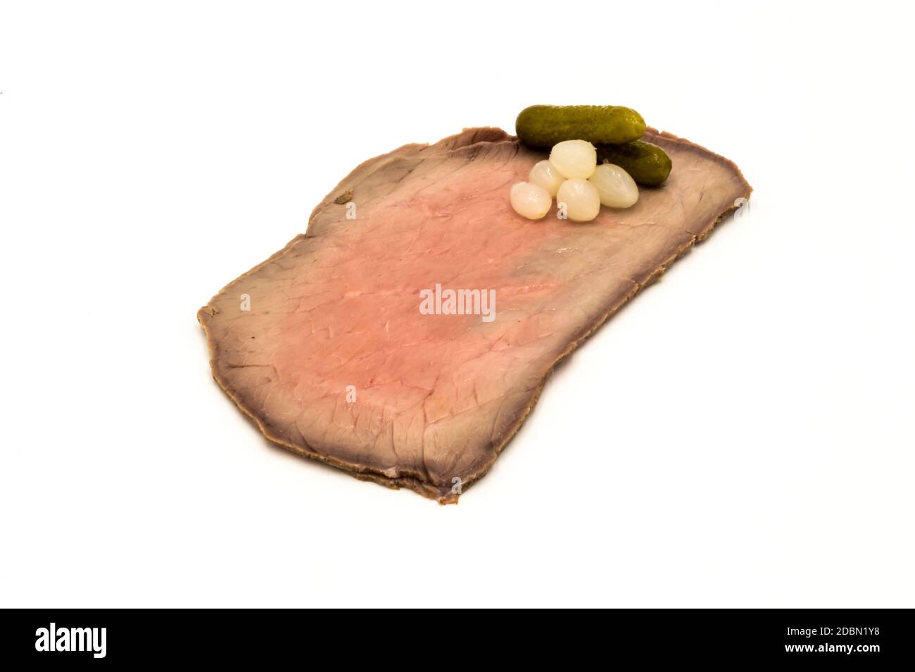 slices of roast beef perfectly arranged with small onions and pickles ...