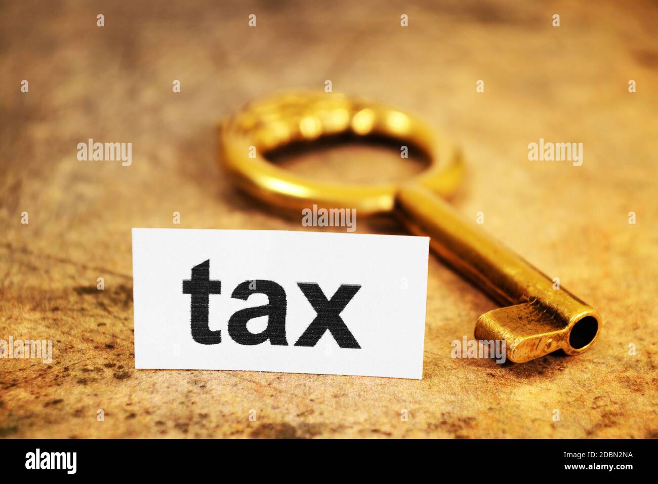 Tax and golden key Stock Photo - Alamy