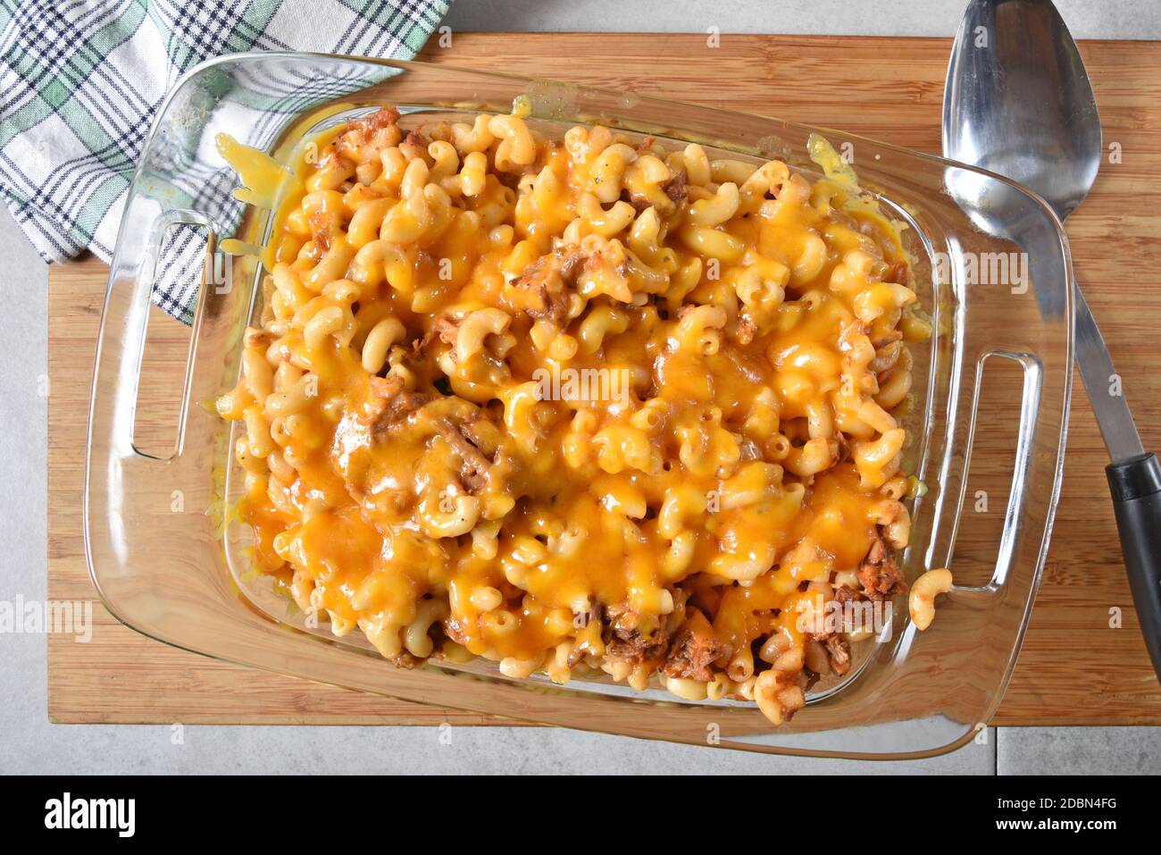 Overhead view of a baked maccroni and cheese casserole with barbecued ...