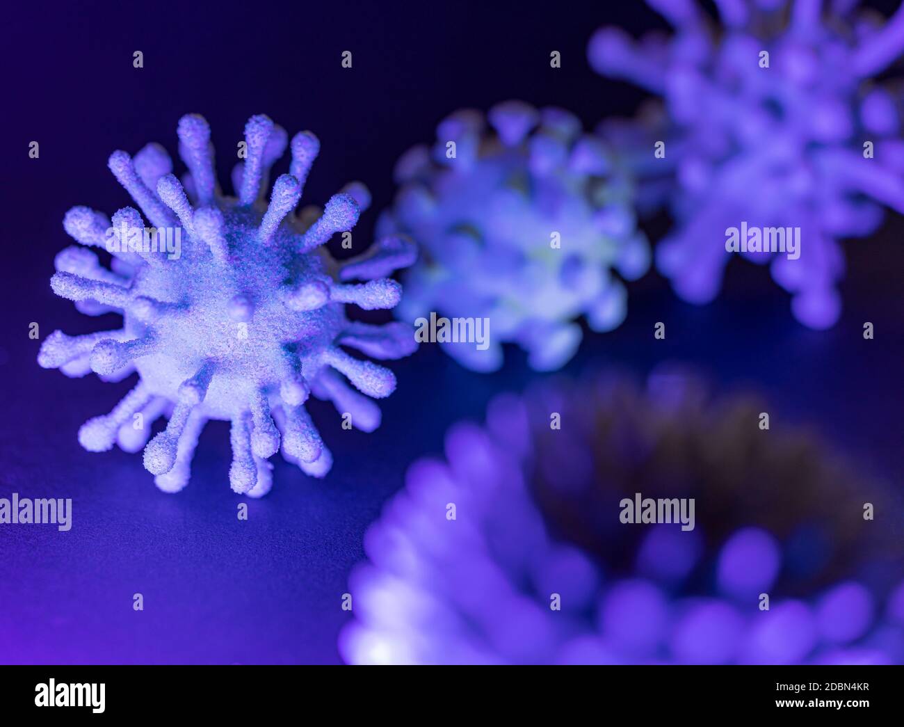 picture of some colorful illuminated symbolic viruses in dark back ...