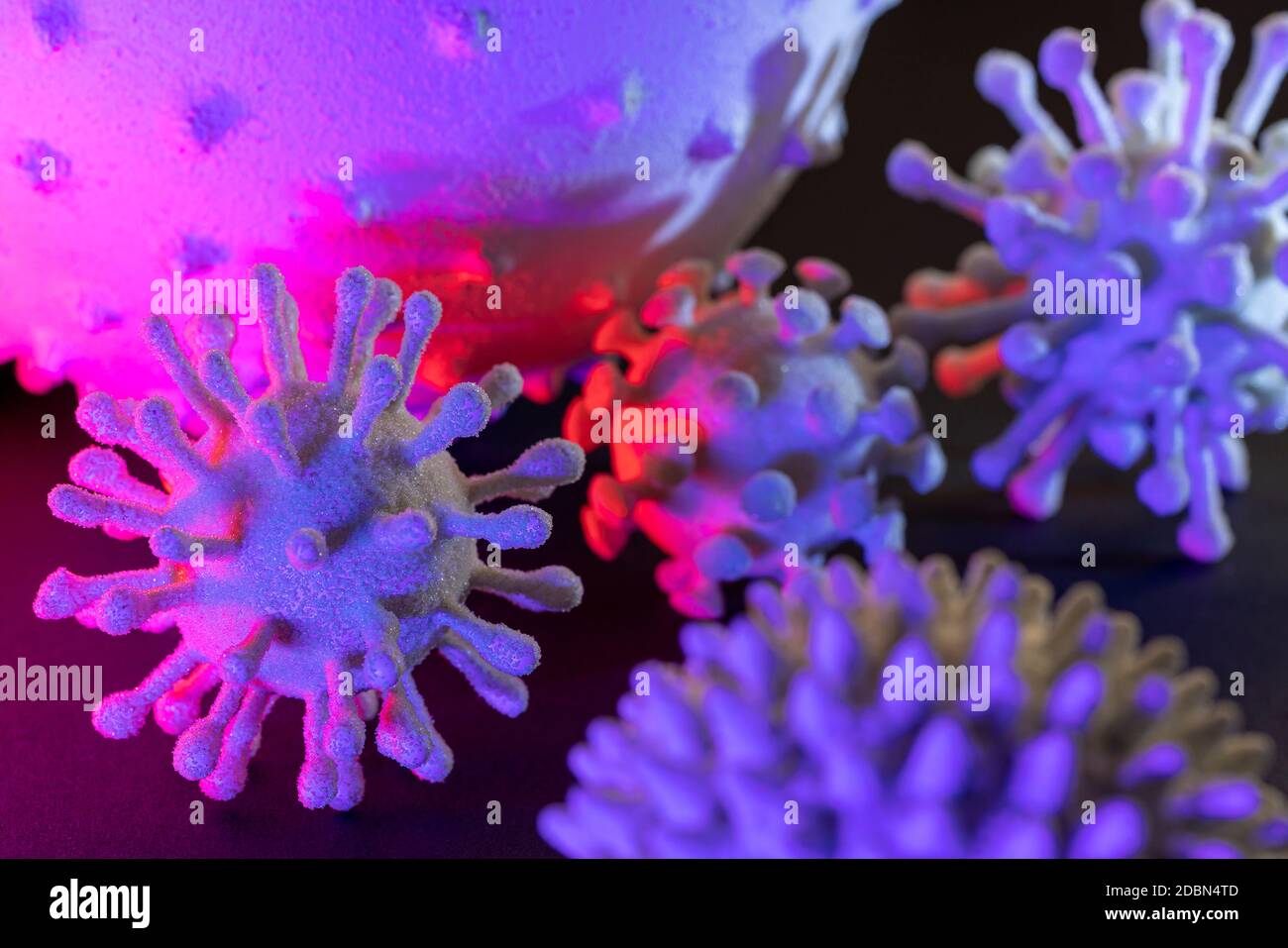 picture of some colorful illuminated symbolic viruses in dark back ...