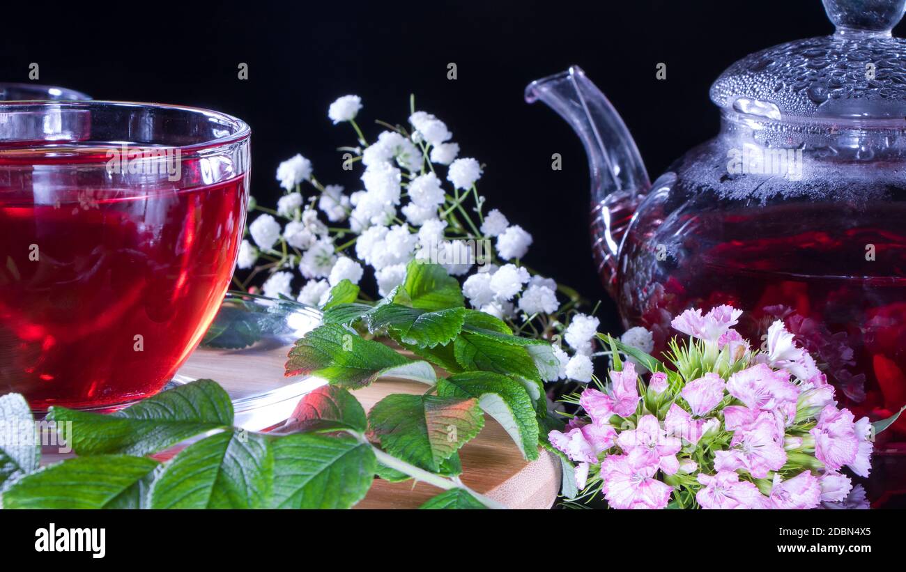 Mugs of red tea with carnation flowers. Zen tea ceremony. English tea ...