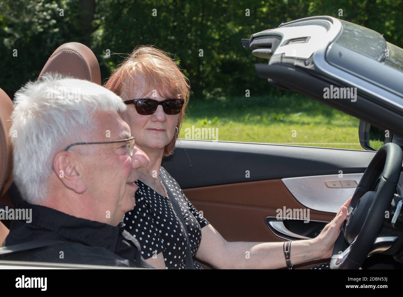 Happy elderly couple sports car hi-res stock photography and images - Alamy