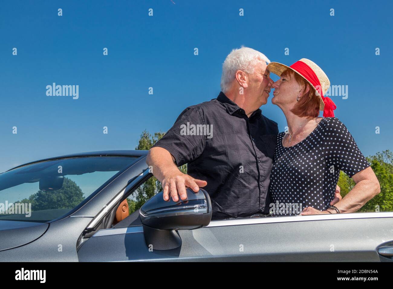Older couple in love ride in convertible car Stock Photo - Alamy