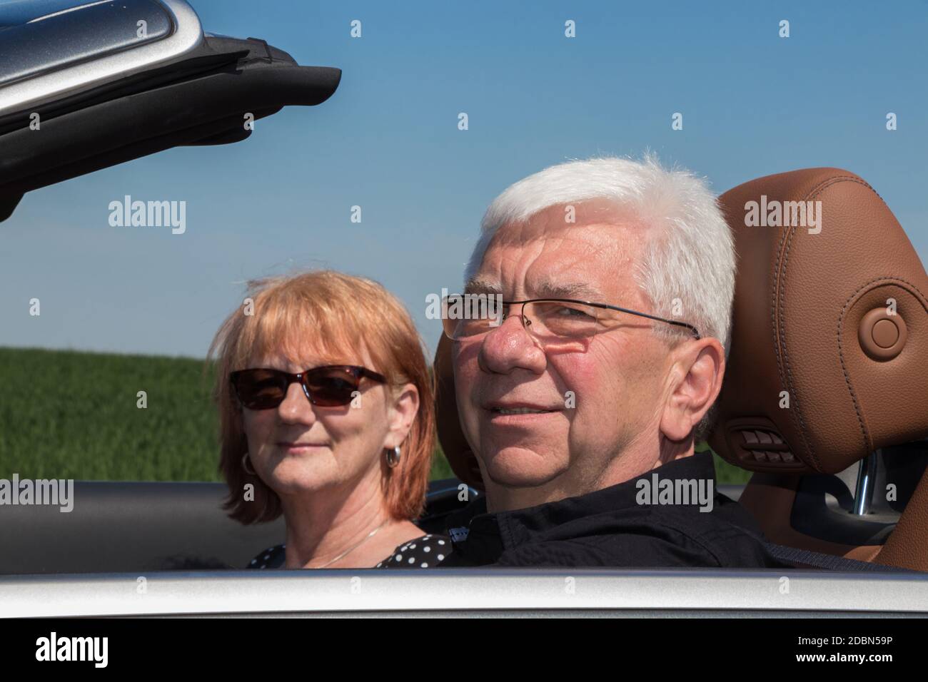 Happy elderly couple sports car hi-res stock photography and images - Alamy